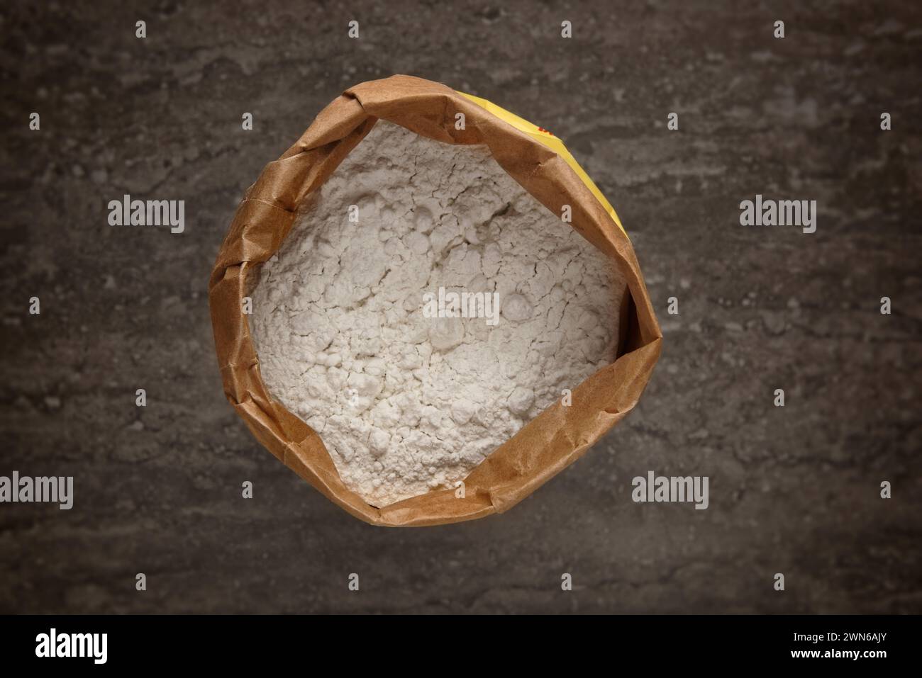 A top view of a brown paper bag of white flour on a table Stock Photo ...