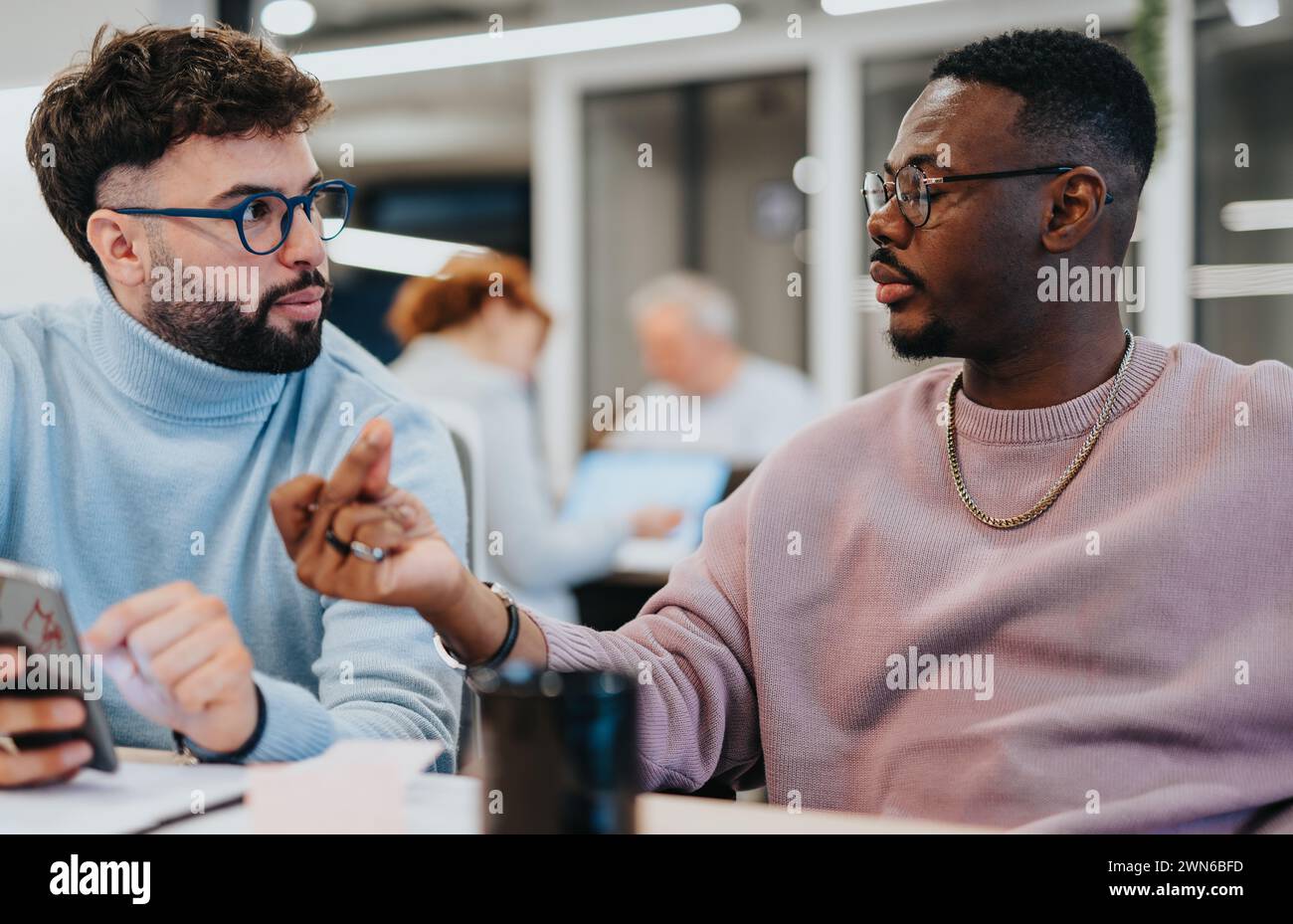 Corporate office teamwork: Focused colleagues strategizing success ...