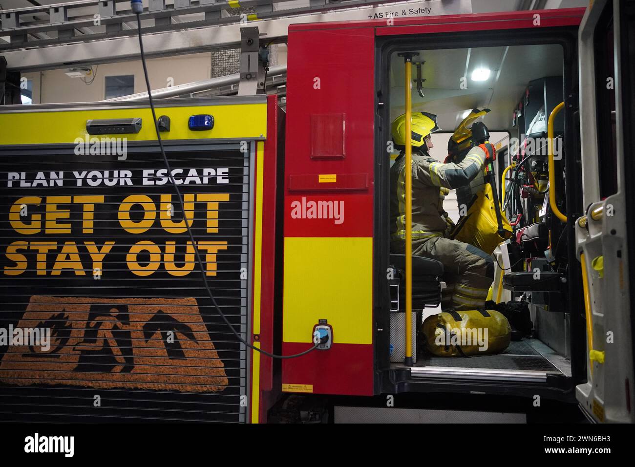 Firefighter officers run through a practice drill during a London Fire ...