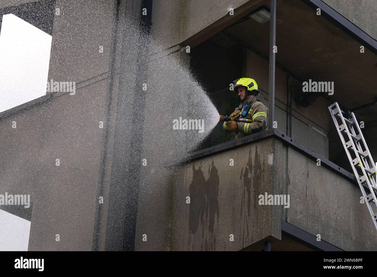 Firefighter officers run through a practice drill during a London Fire ...