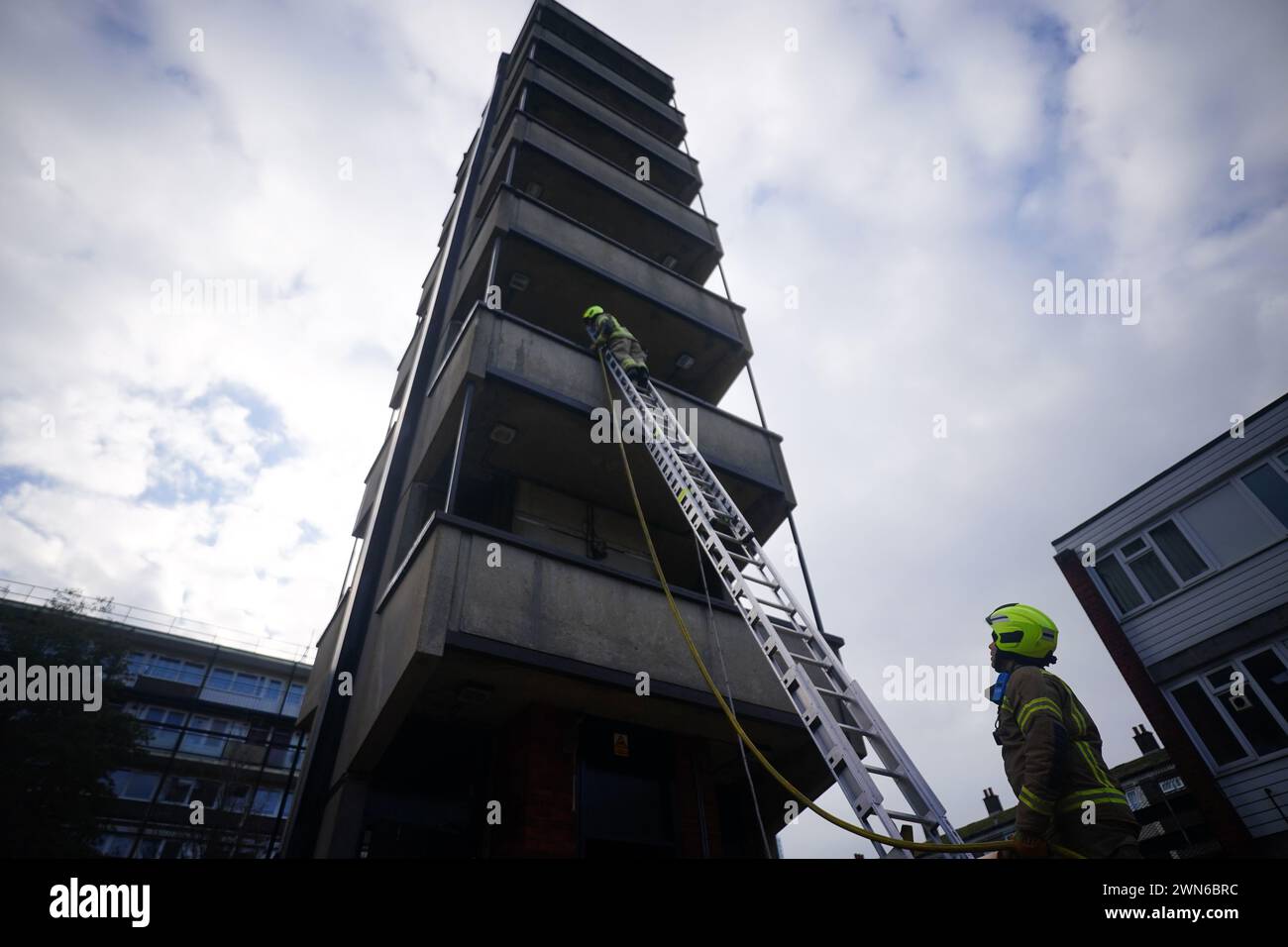 Firefighter officers run through a practice drill during a London Fire ...