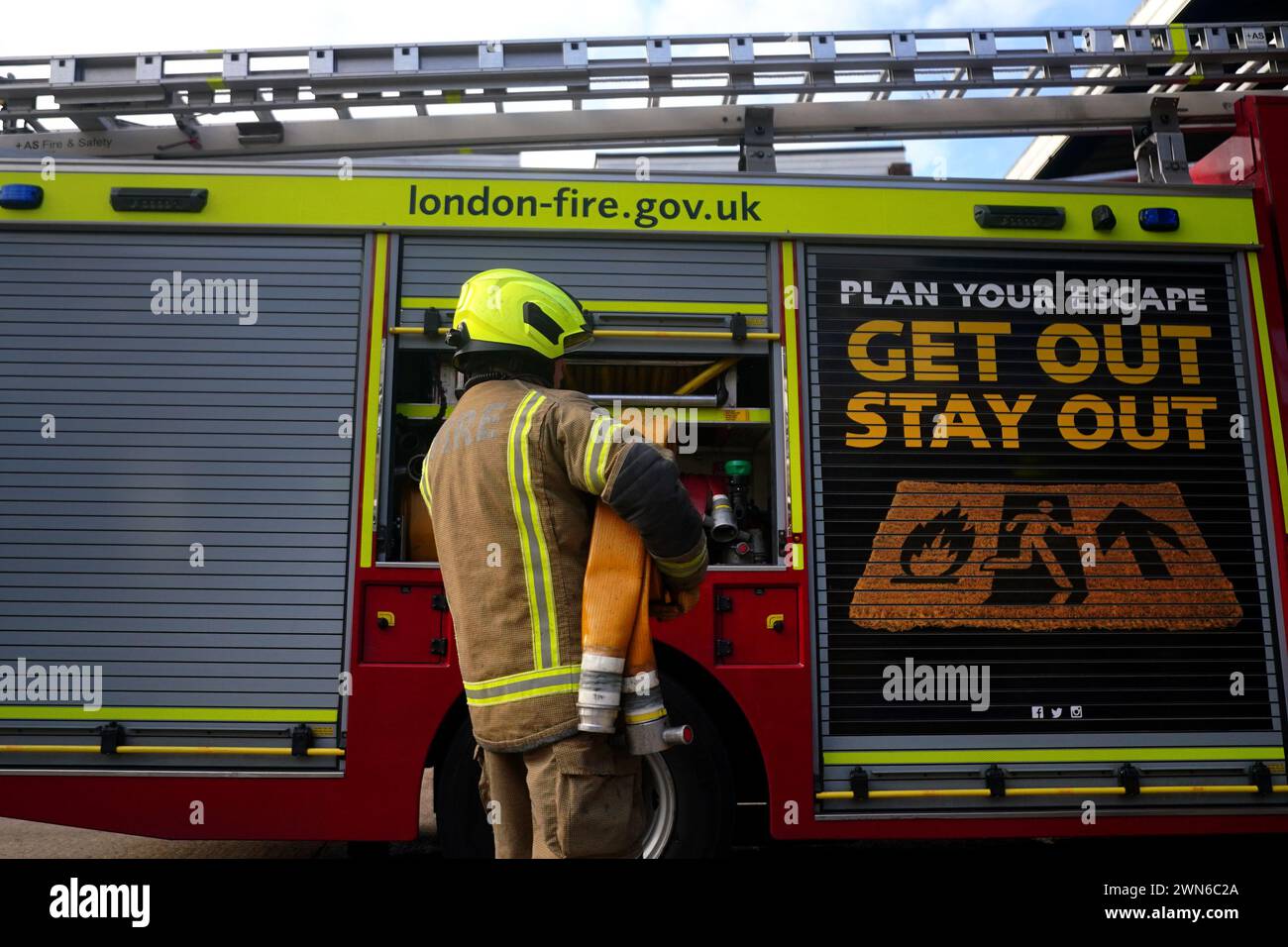 Firefighter officers run through a practice drill during a London Fire ...