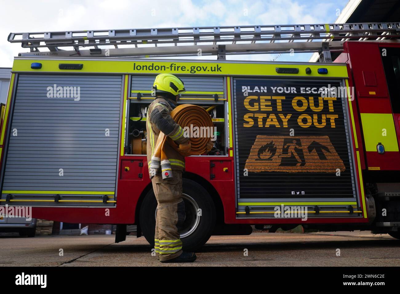 Firefighter officers run through a practice drill during a London Fire ...