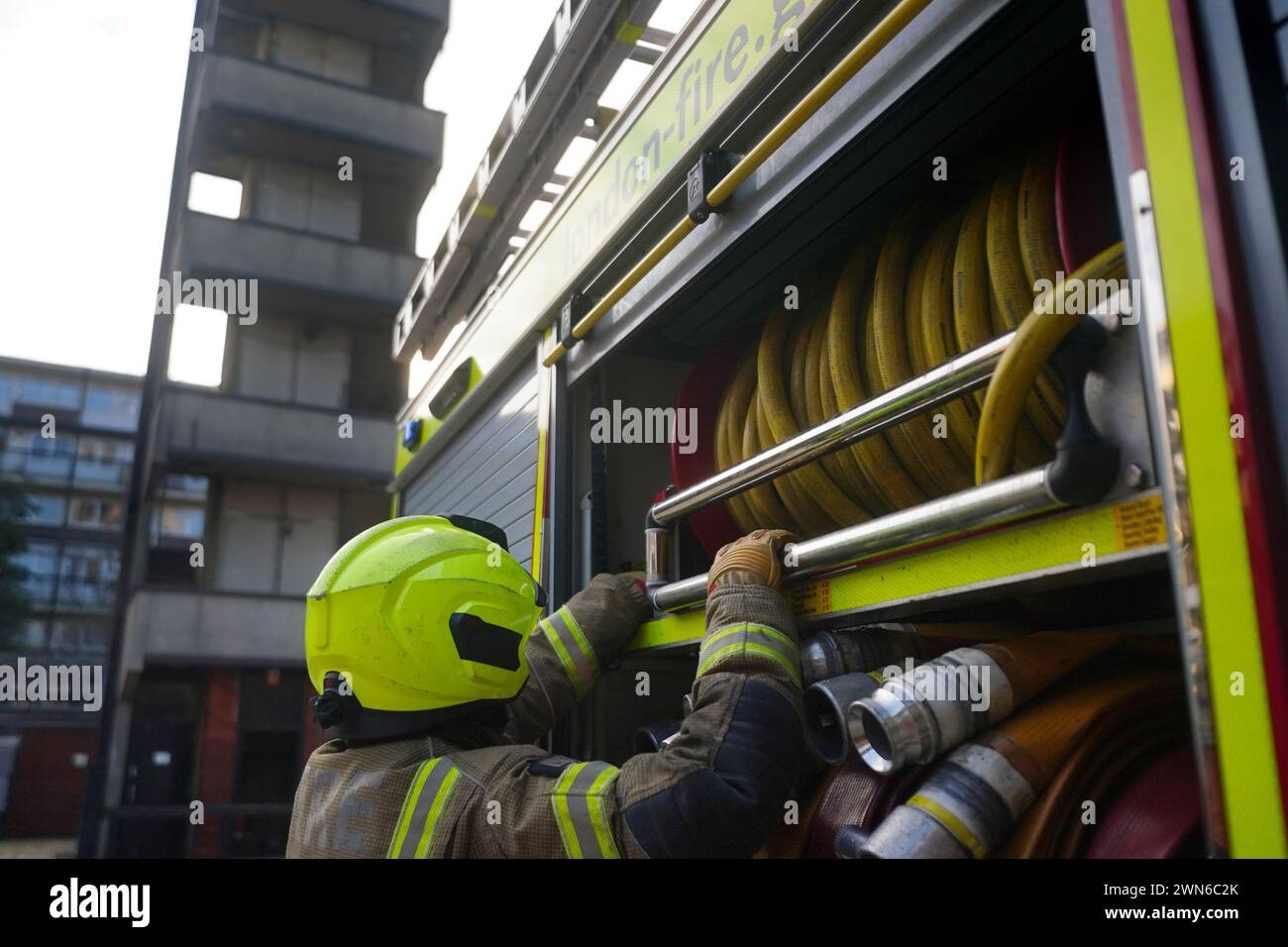 Firefighter officers run through a practice drill during a London Fire ...