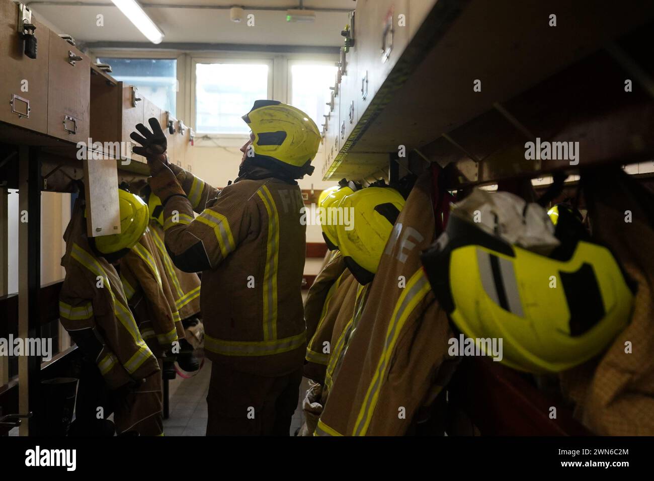 Firefighter officers run through a practice drill during a London Fire ...