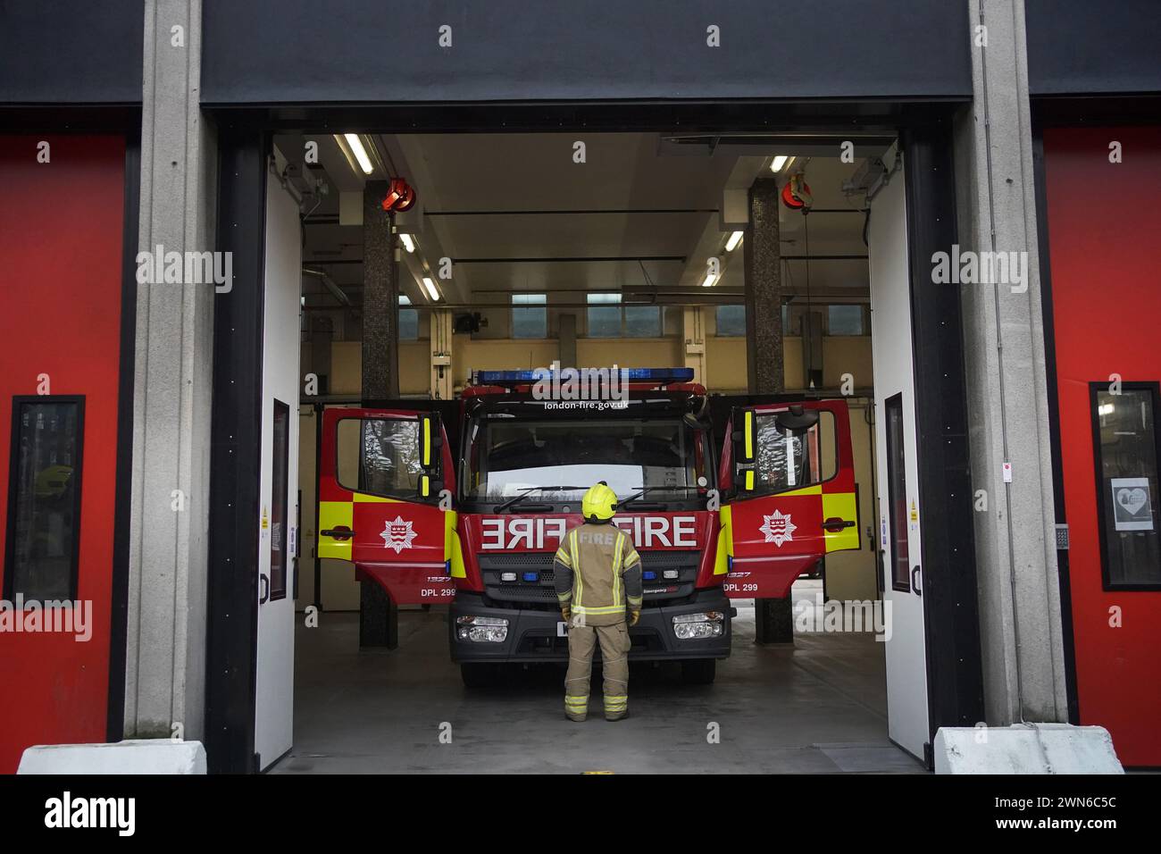 Firefighter officers run through a practice drill during a London Fire ...