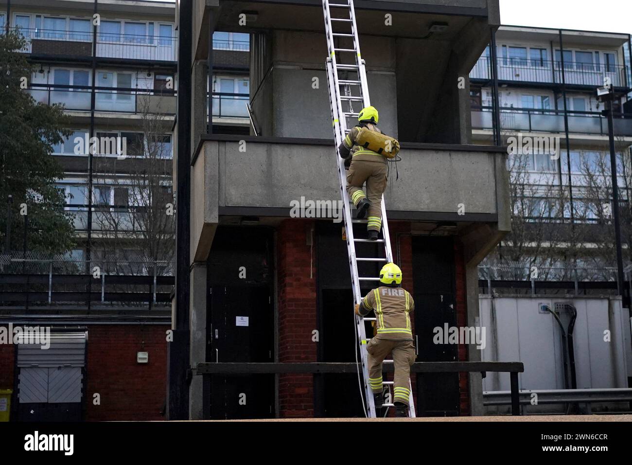 Firefighter officers run through a practice drill during a London Fire ...