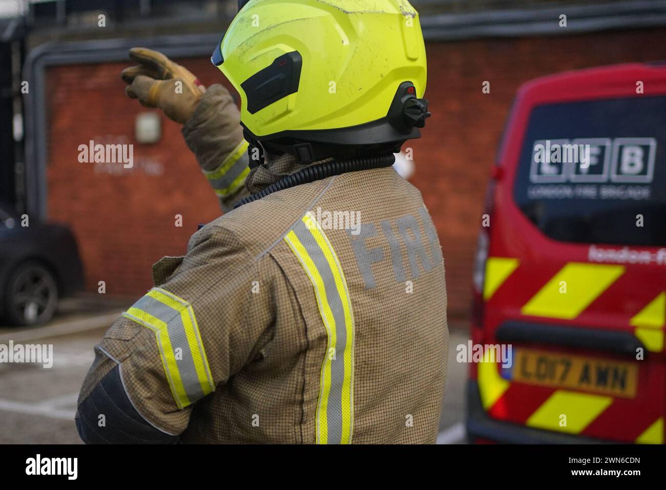 Firefighter officers run through a practice drill during a London Fire ...
