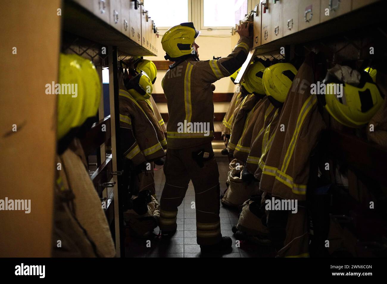 Firefighter officers run through a practice drill during a London Fire ...