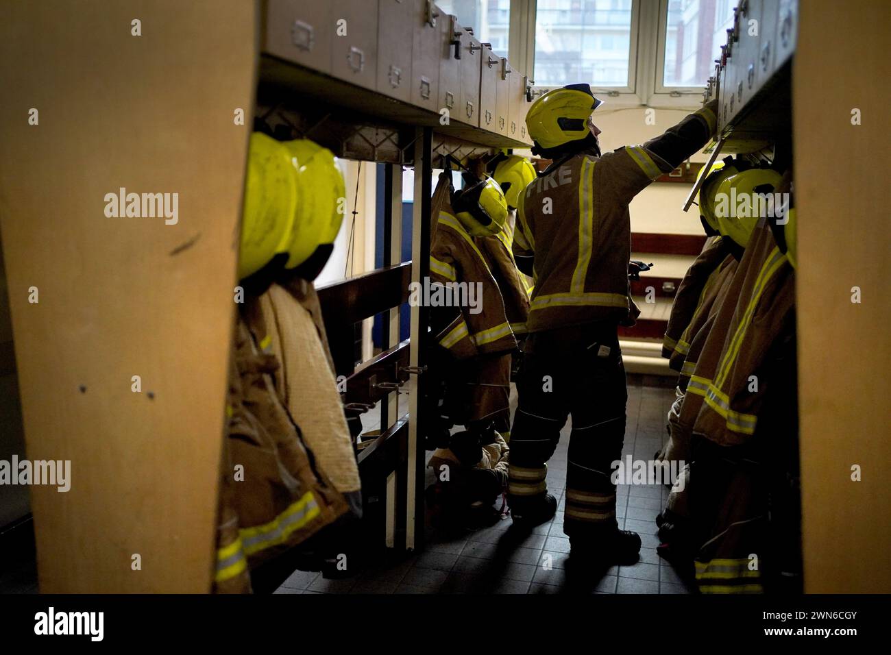 Firefighter officers run through a practice drill during a London Fire ...