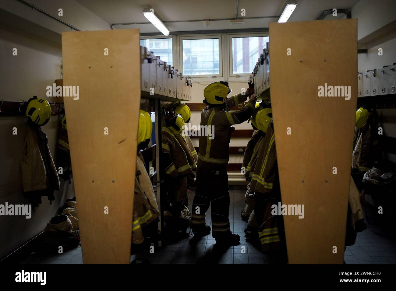 Firefighter officers run through a practice drill during a London Fire ...