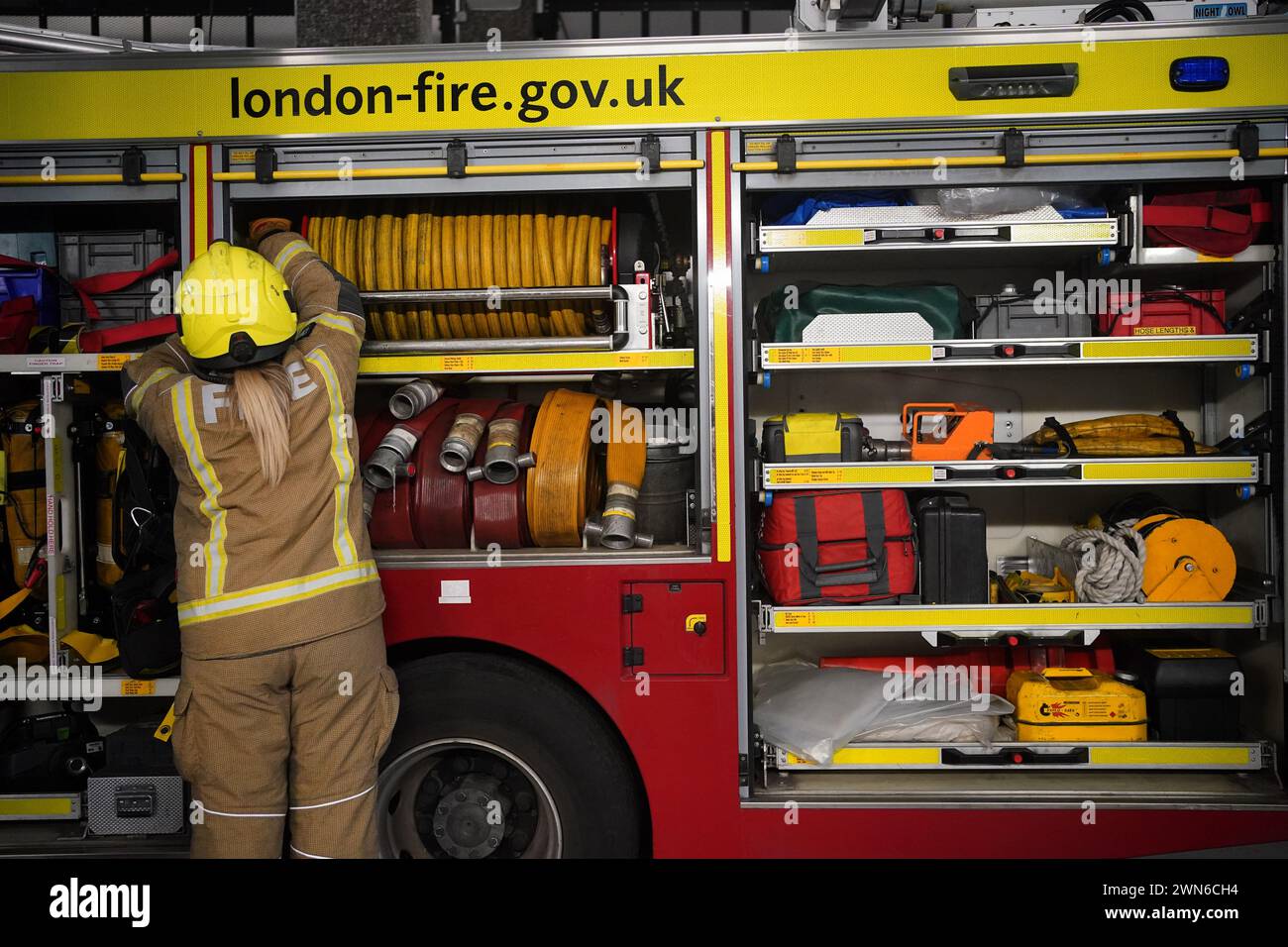 Firefighter officers run through a practice drill during a London Fire ...