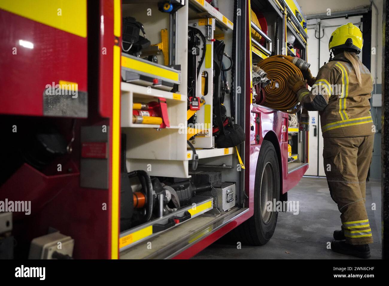 Firefighter officers run through a practice drill during a London Fire ...