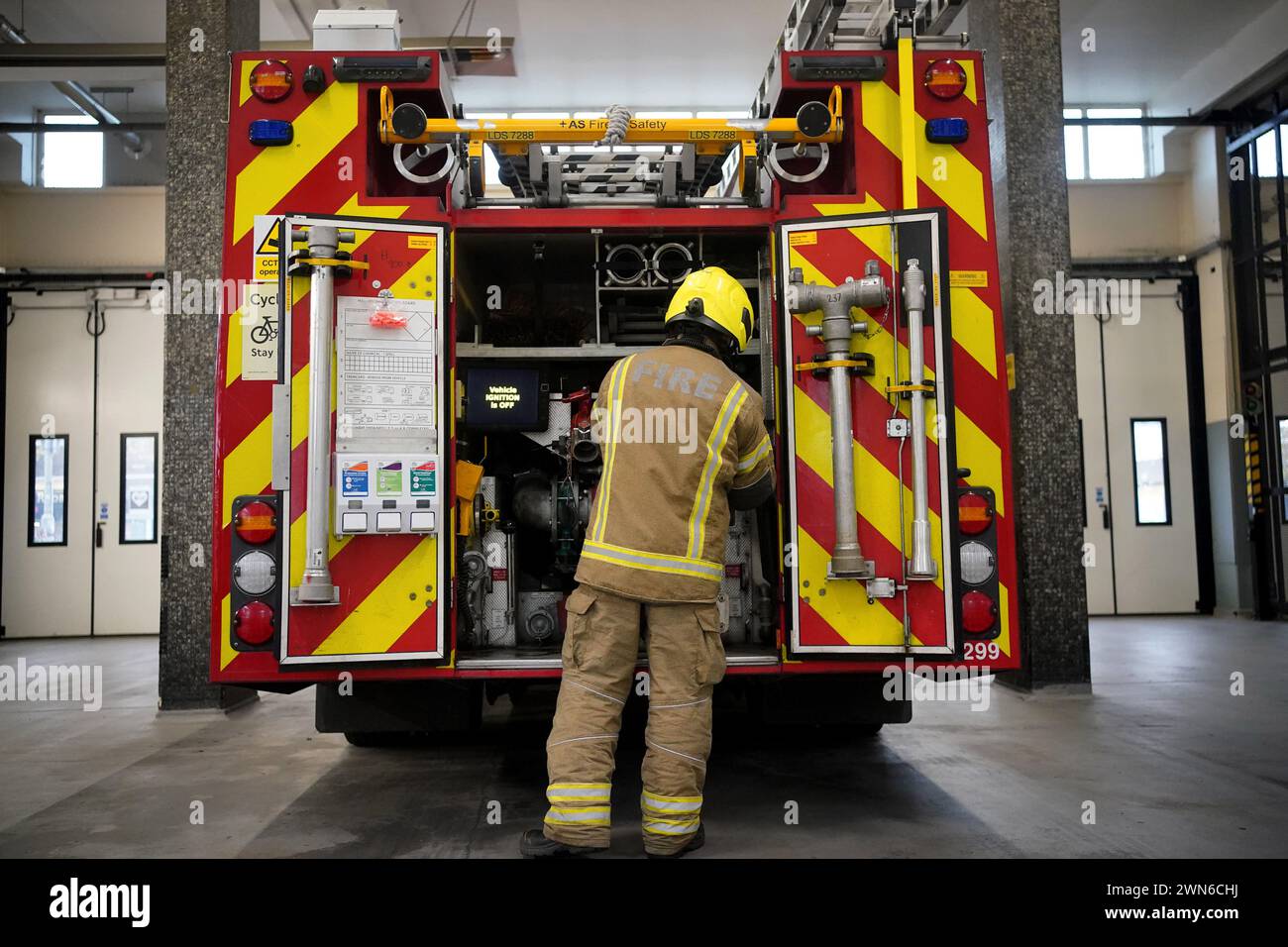 Firefighter officers run through a practice drill during a London Fire ...