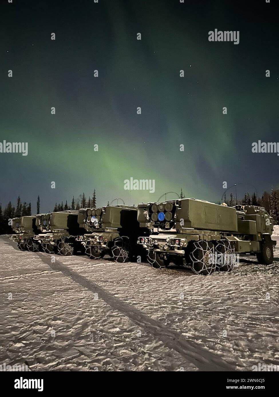 Northern lights are visible above High Mobility Artillery Rocket System ...