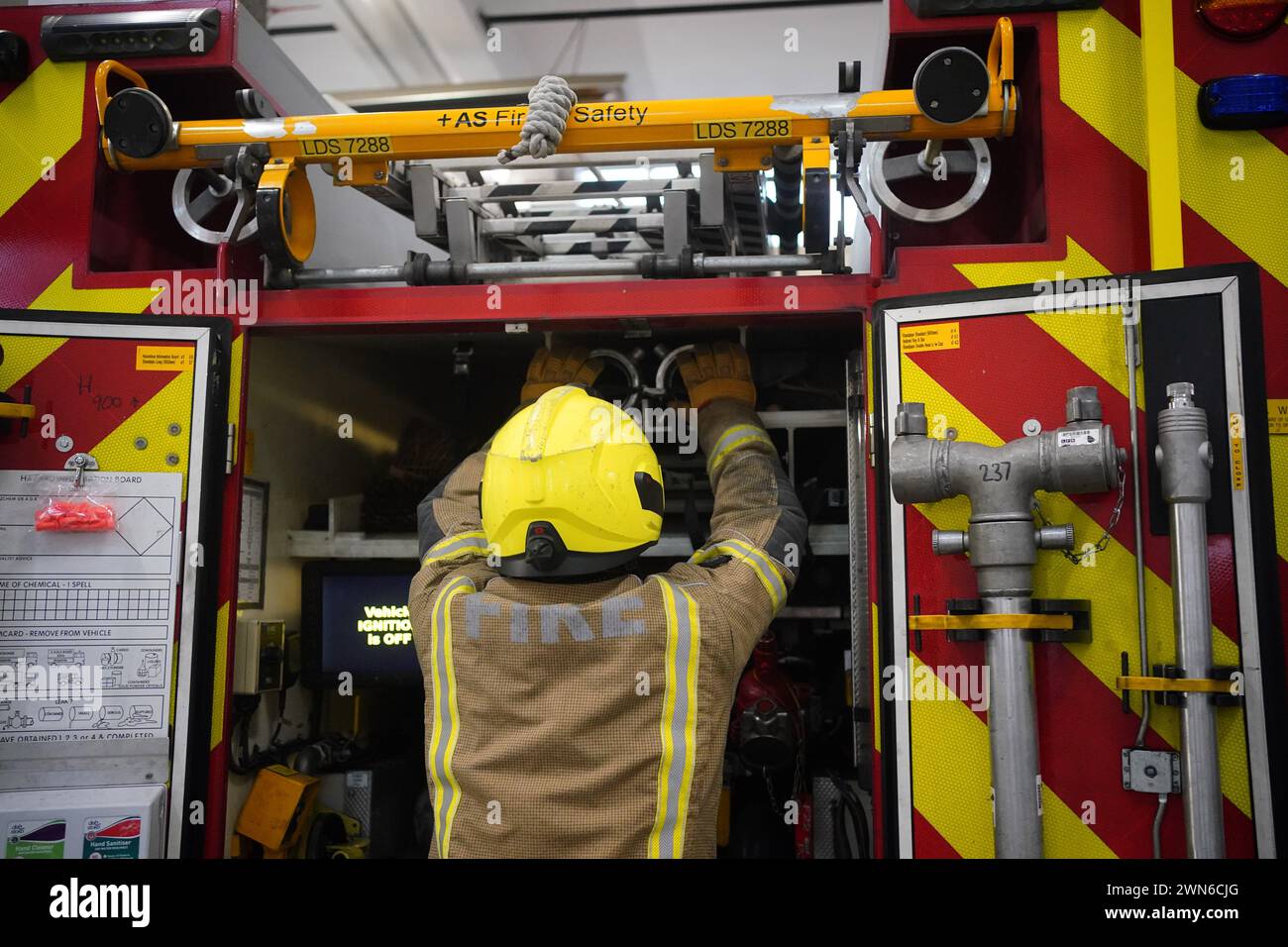 Firefighter officers run through a practice drill during a London Fire ...