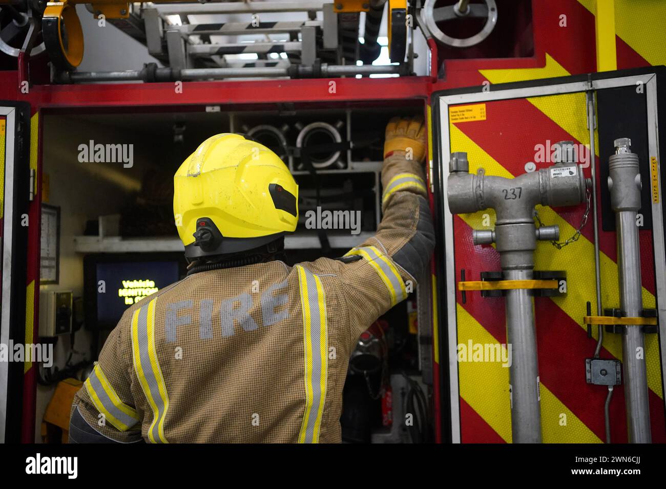 Firefighter officers run through a practice drill during a London Fire ...