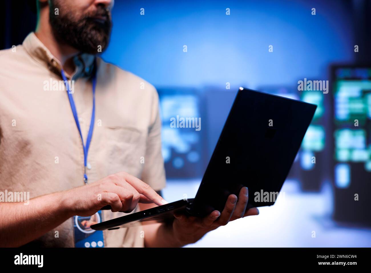 Technical support worker ensuring data center servers are properly ...