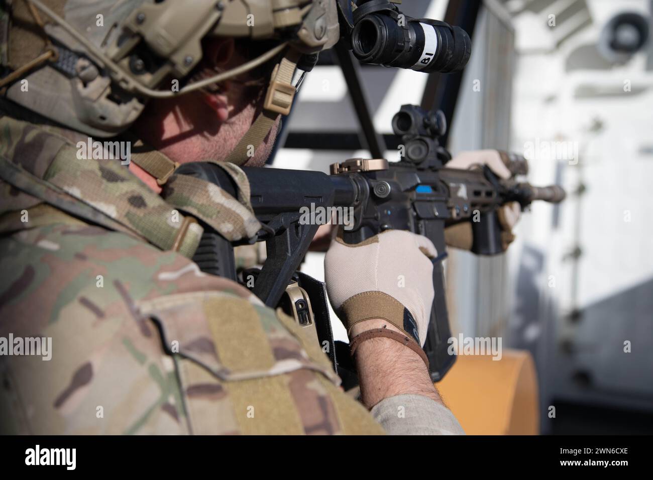 A U.S. East Coast-based Naval Special Warfare Operator (SEAL) aims his ...