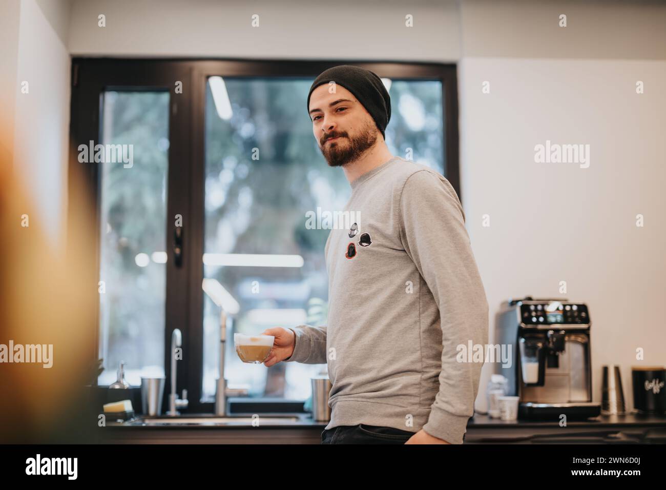 Male, business employee having a conversation with his teammates before ...