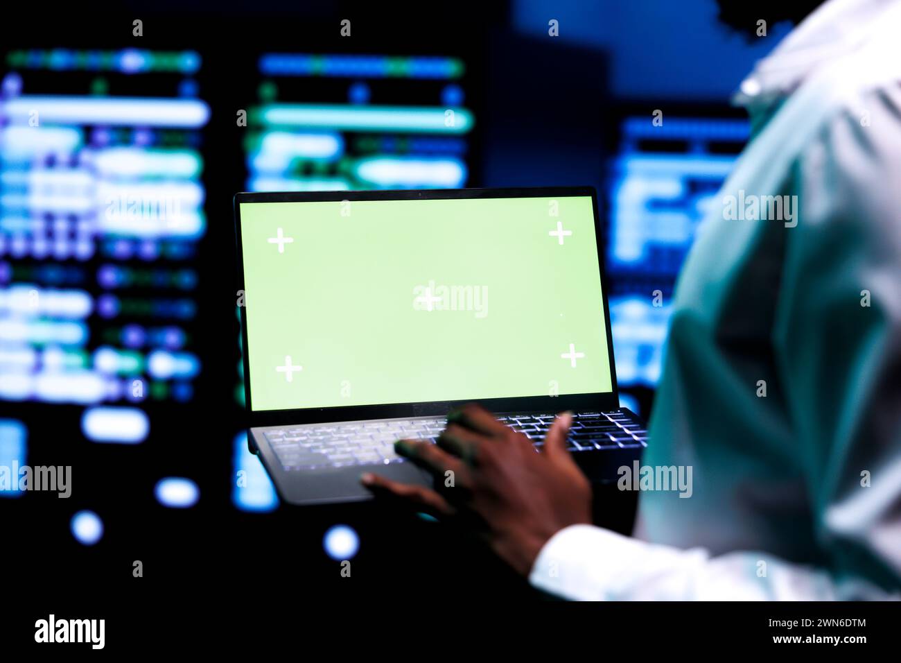 Computer scientist using green screen laptop to verify configuration ... Computer scientist using green screen laptop to verify configuration ...