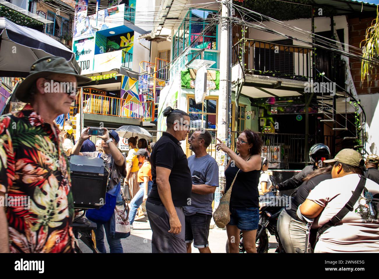 MEDELLIN, COLOMBIA - JANUARY 17, 2024: Tourists at the famous Comuna 13 ...