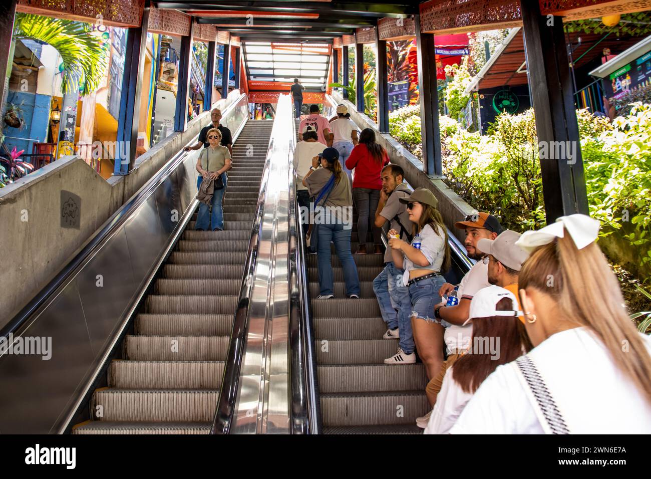 MEDELLIN, COLOMBIA - JANUARY 17, 2024: Tourists on the escalators of ...
