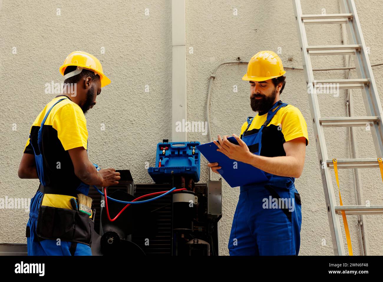 Capable electricians team employed to do air conditioner check ...