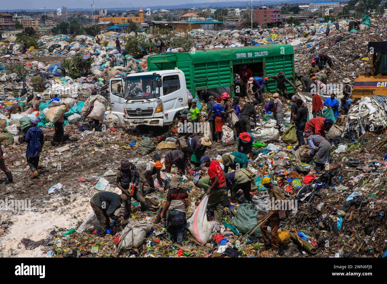 Nairobi, KENYA. 28th Feb, 2024. Waste collectors offloading waste ...