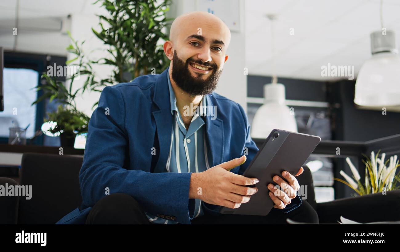 Business manager reviewing analytics, looking at annual official ...