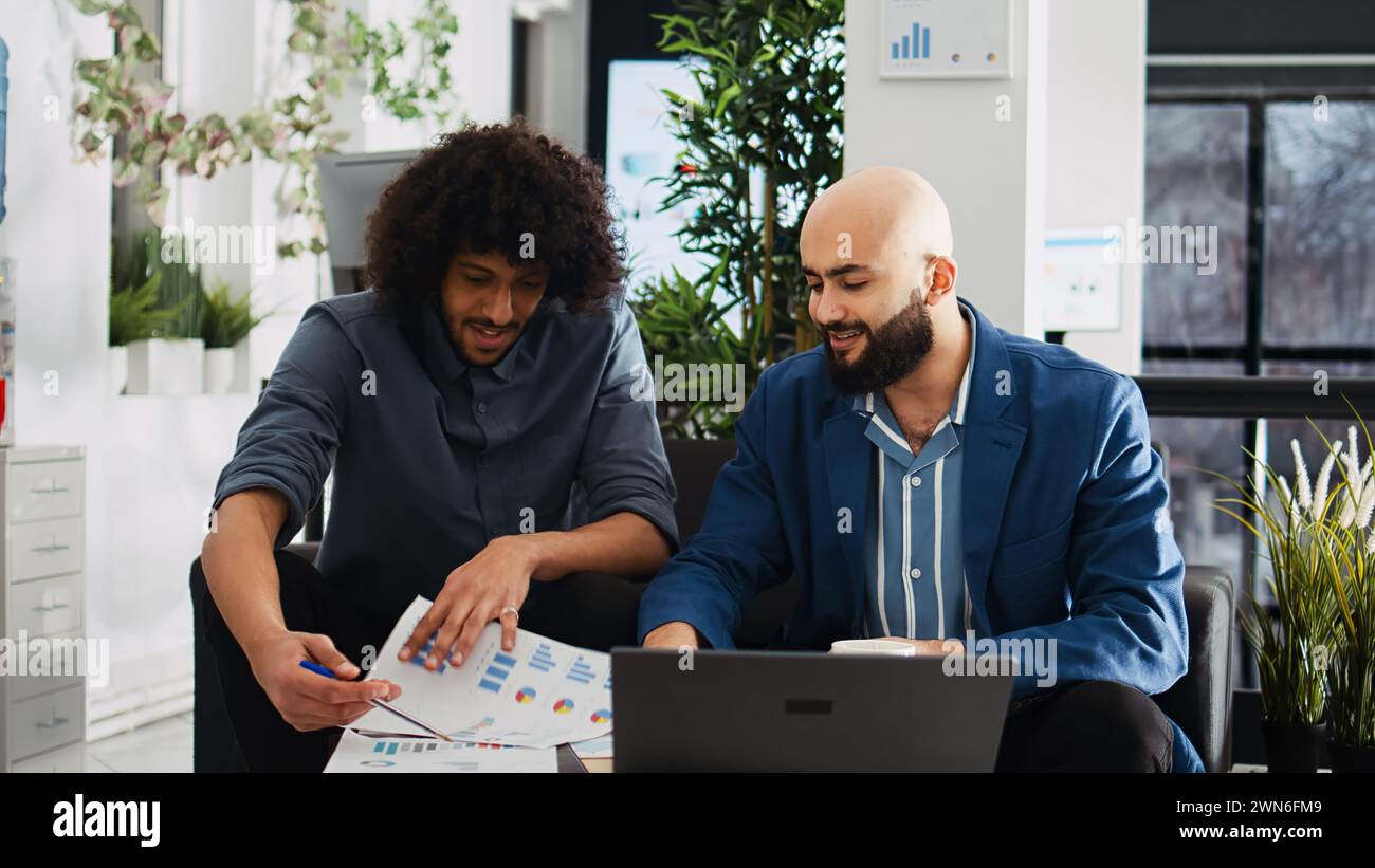 Business team examine annual reports and working on collaboration to ...