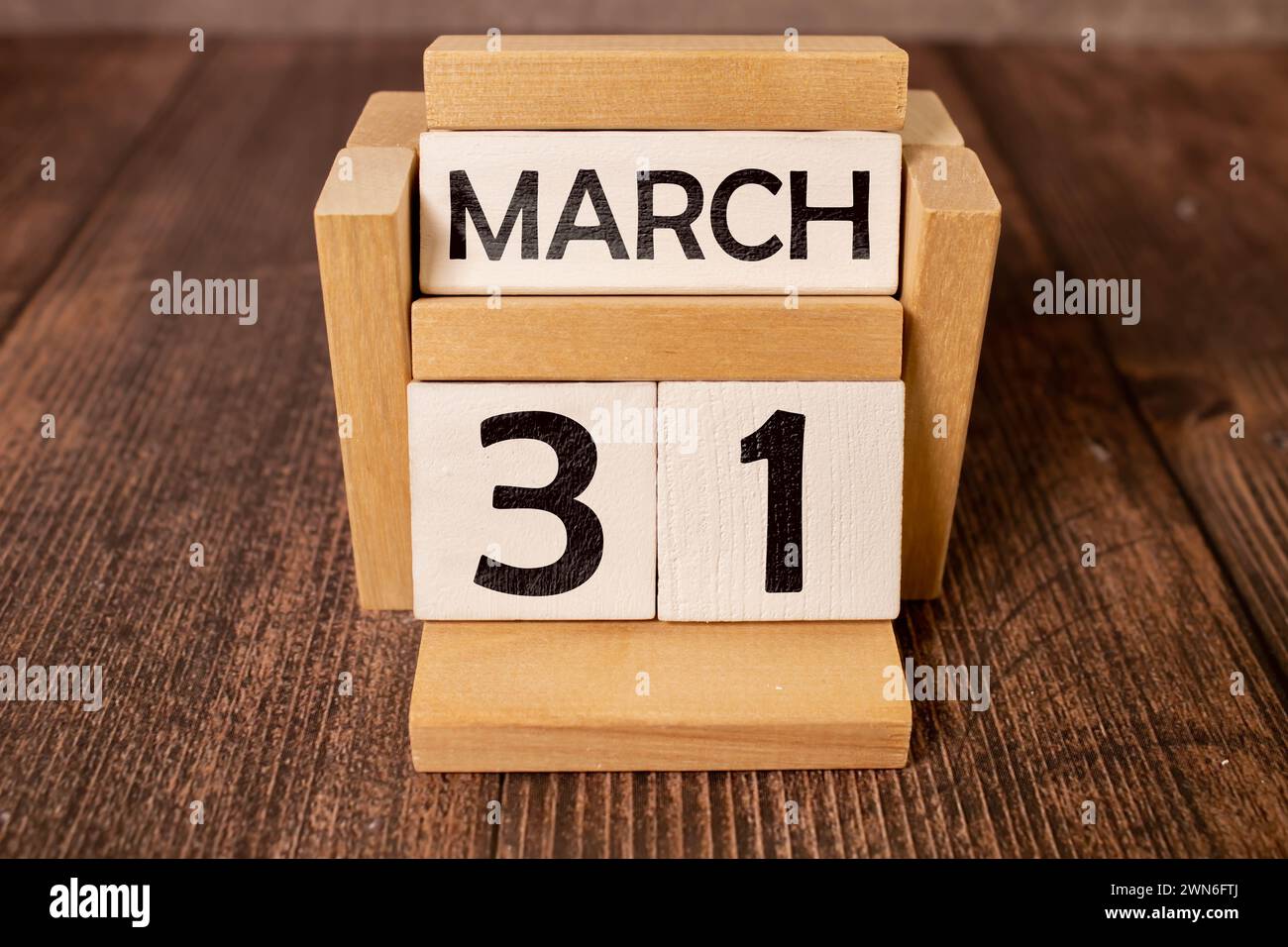 March 31st. Image of march 31 wooden color calendar on white brick wall ...