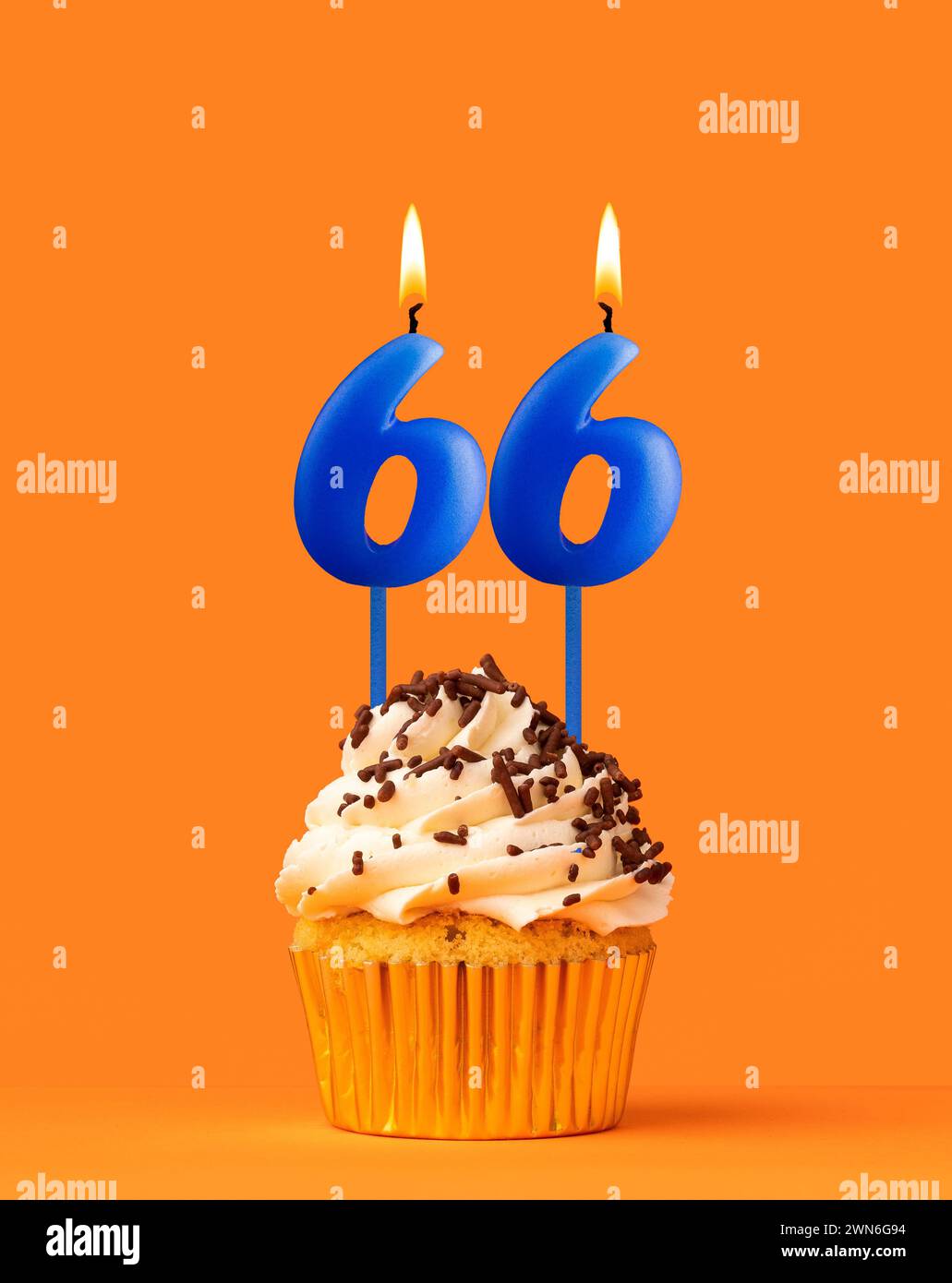 Blue birthday candle and cupcake - Number 66 Stock Photo - Alamy