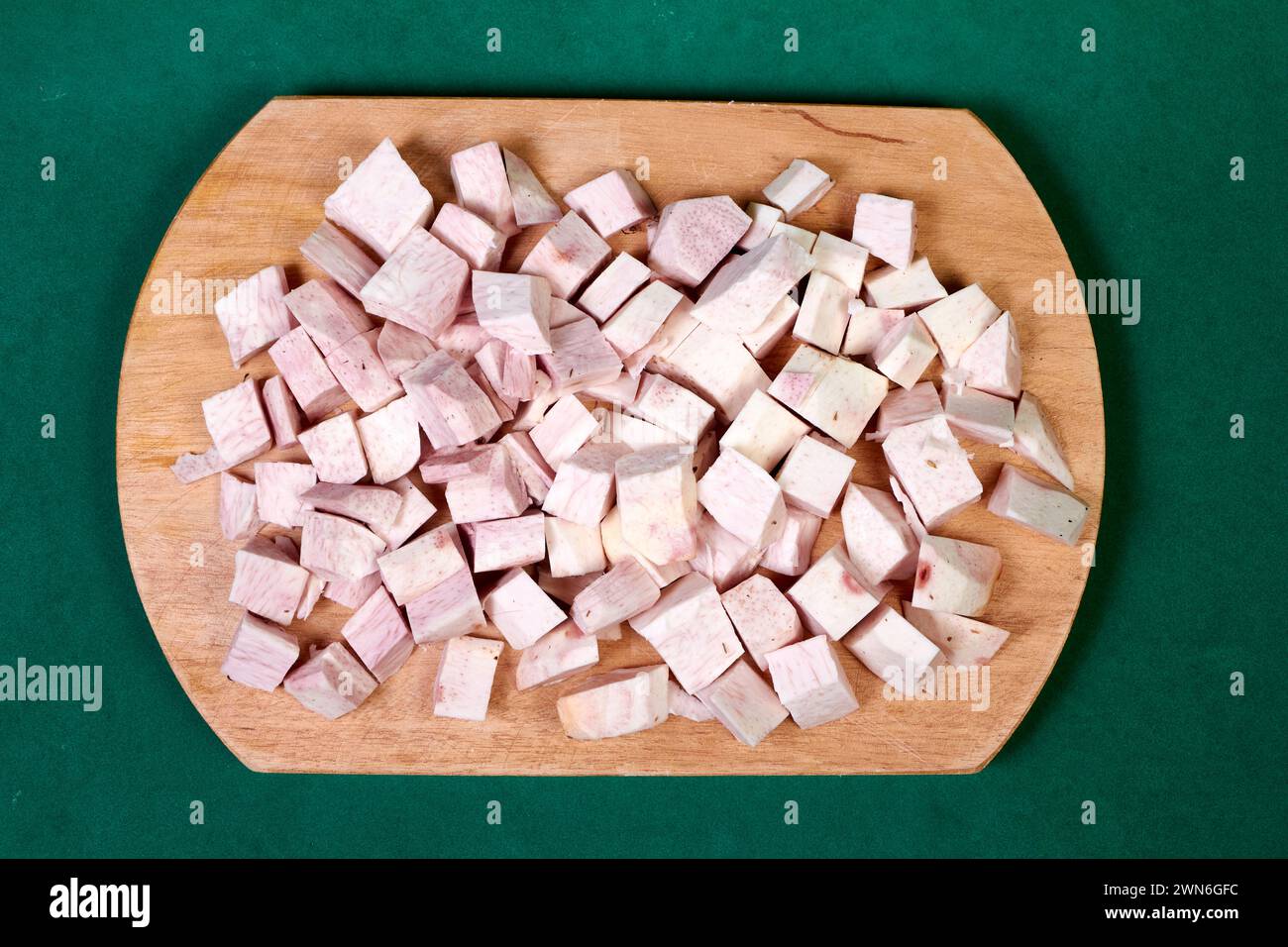 closeup of taro root vegetable, eddo malanga, green background Stock ...