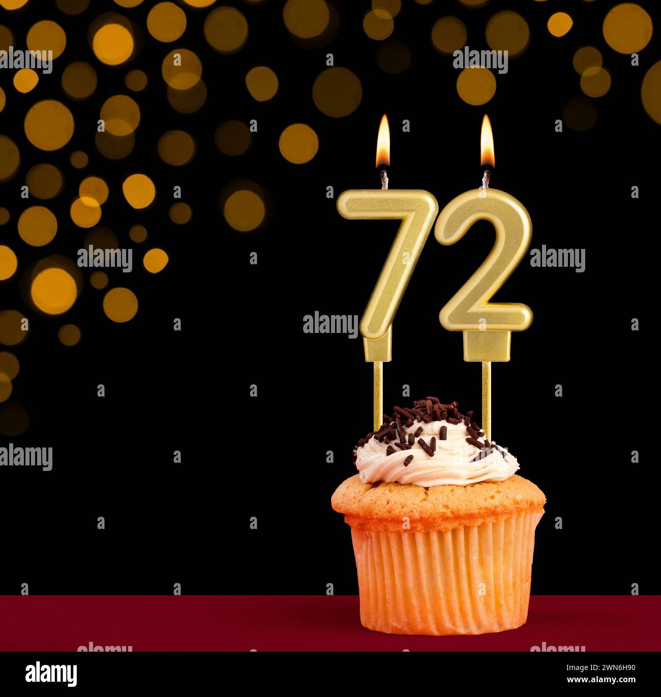 Birthday candle with cupcake - Number 72 on black background with out ...