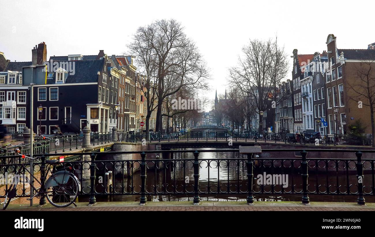 Amsterdam, Netherlands - feb 18, 2013 - view of canal with boats and ...