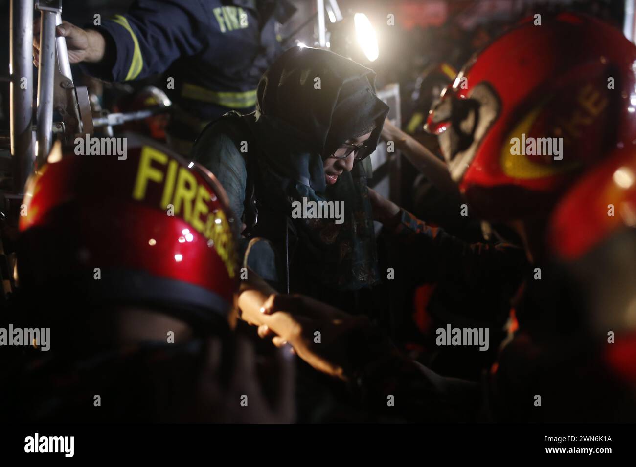 Firefighters are working to extinguish a fire in a commercial building ...