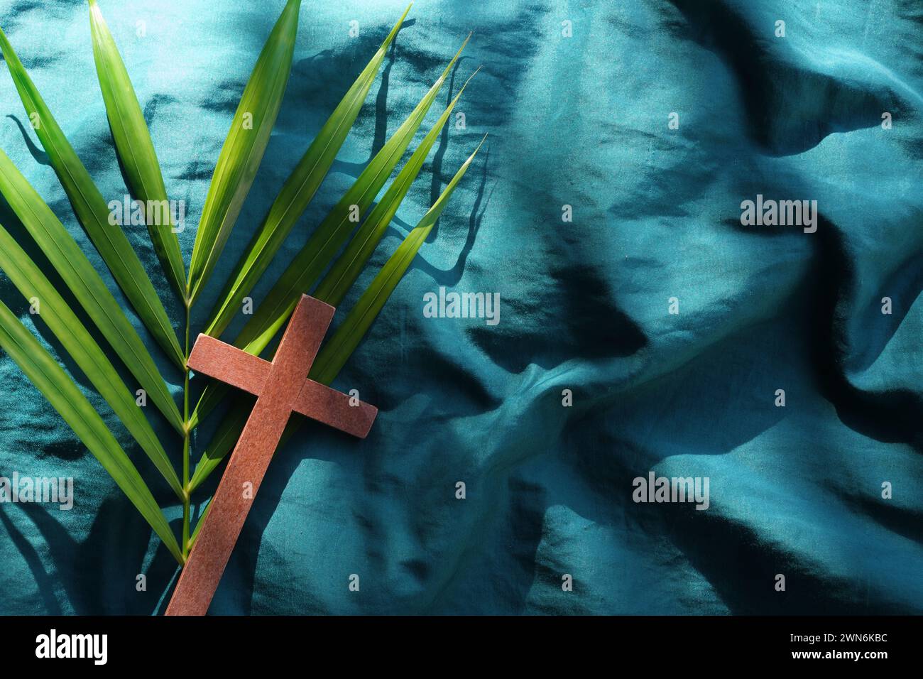 Palm leaves with wooden crucifix cross flat lay composition. Palm ...