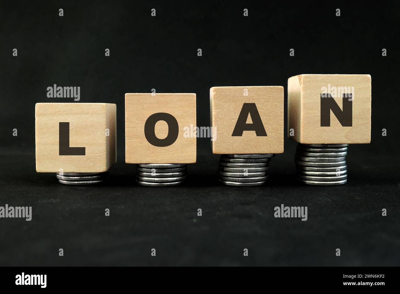 Increasing loan concept. Wooden blocks with increasing stack of coins ...