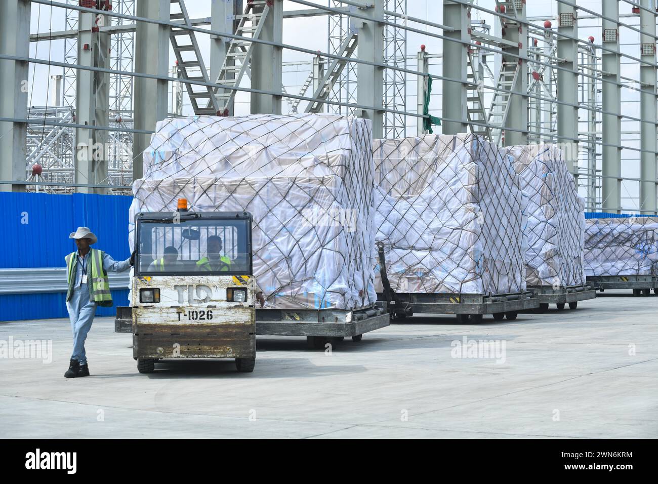 Addis Ababa, Ethiopia. 29th Feb, 2024. Workers transfer goods outside ...