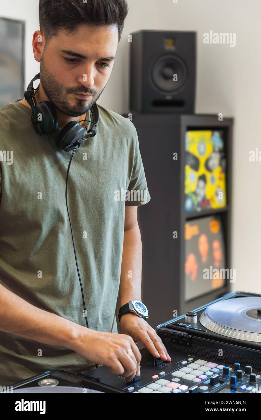 DJ mixing sounds in his home studio Stock Photo - Alamy
