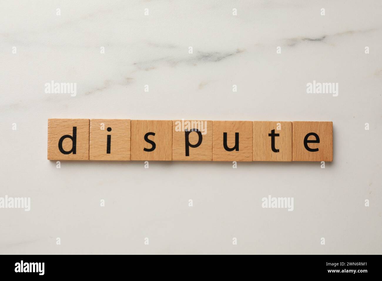Squares with word Dispute on white marble table, top view Stock Photo ...