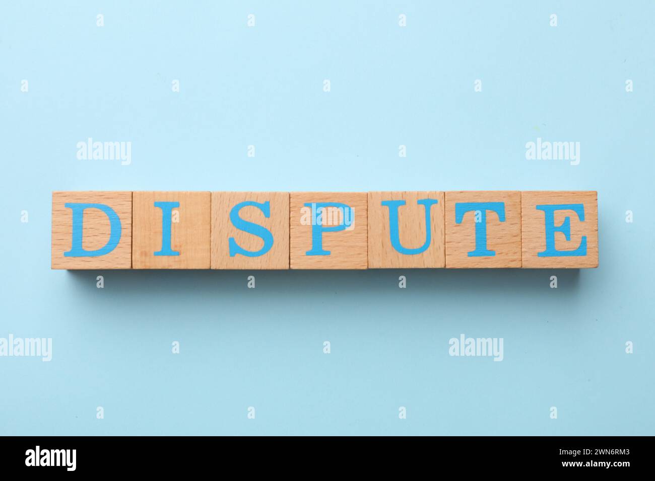 Cubes with word Dispute on light blue background, top view Stock Photo ...