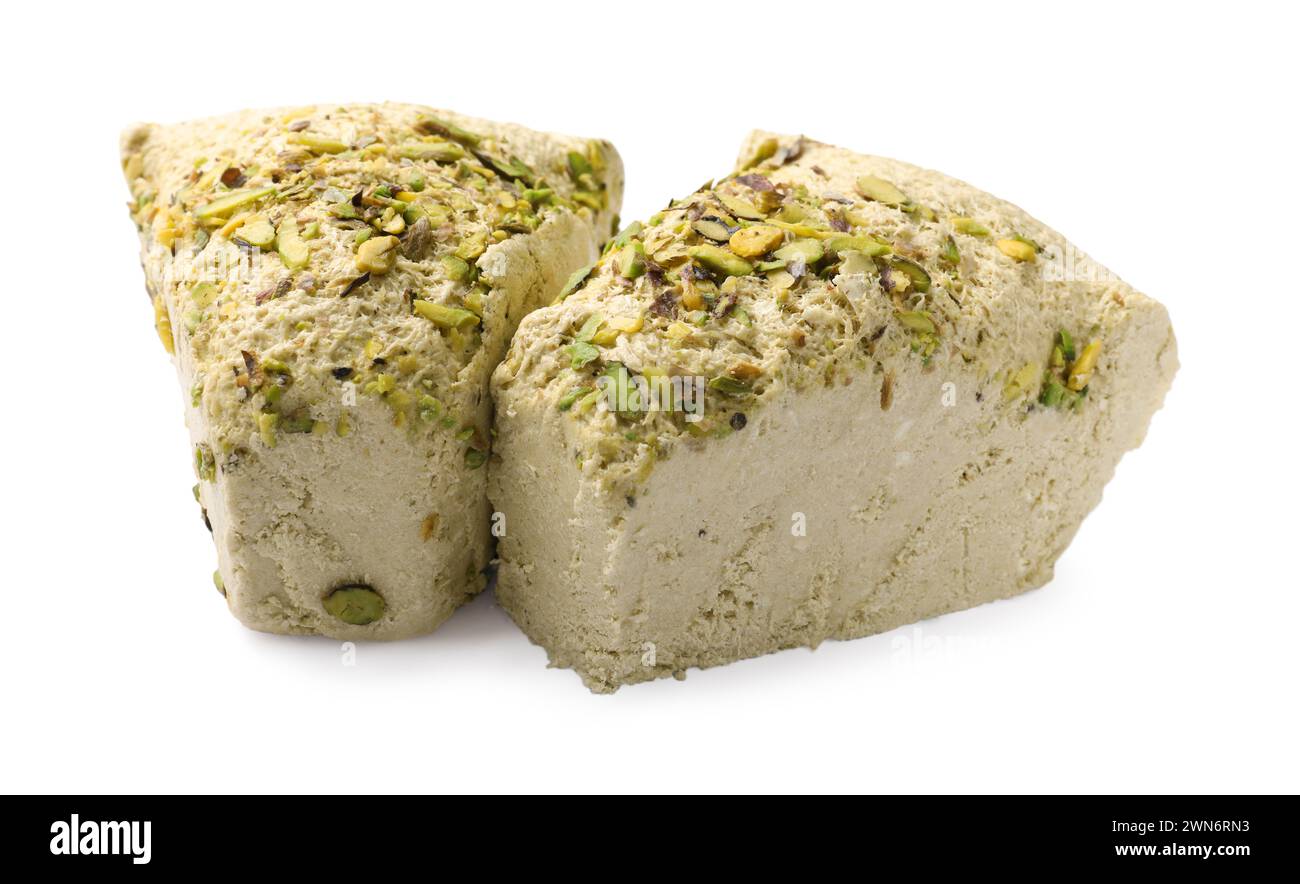 Pieces of tasty halva with pistachios on white background Stock Photo - Alamy