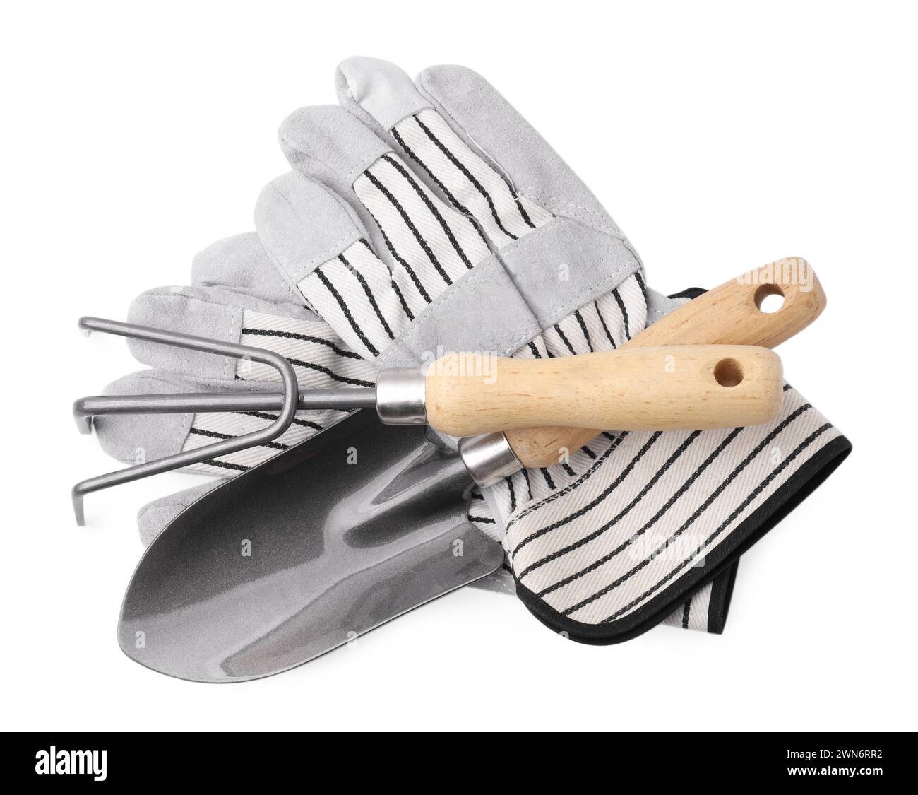Gardening gloves, trowel and rake isolated on white, top view Stock ...