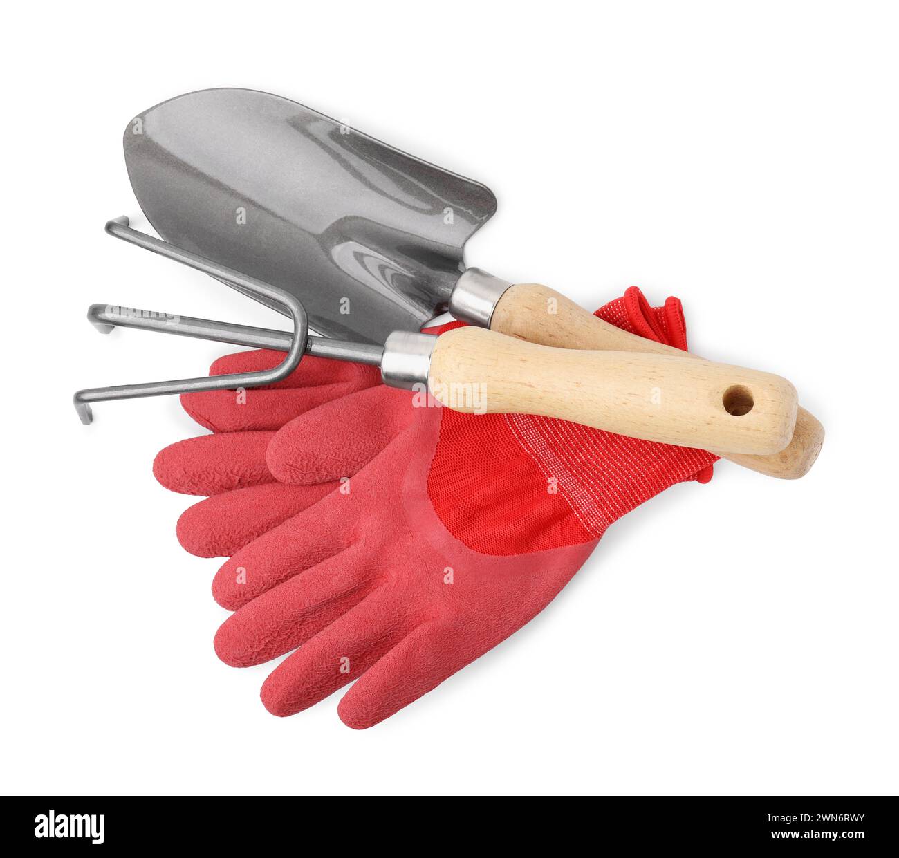 Gardening gloves, trowel and rake isolated on white, top view Stock ...