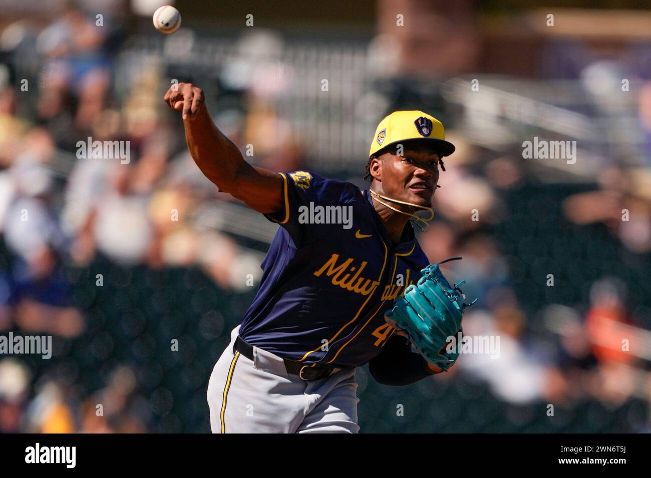 Milwaukee Brewers relief pitcher Abner Uribe throws to first base in a ...