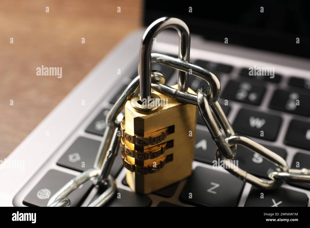 Cyber security. Laptop with padlock and chain on table, closeup Stock ...