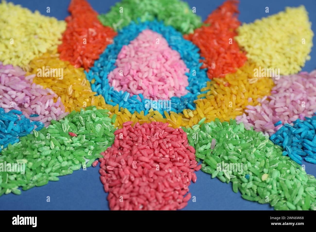 Diwali celebration. Colorful rangoli on blue background, closeup Stock ...