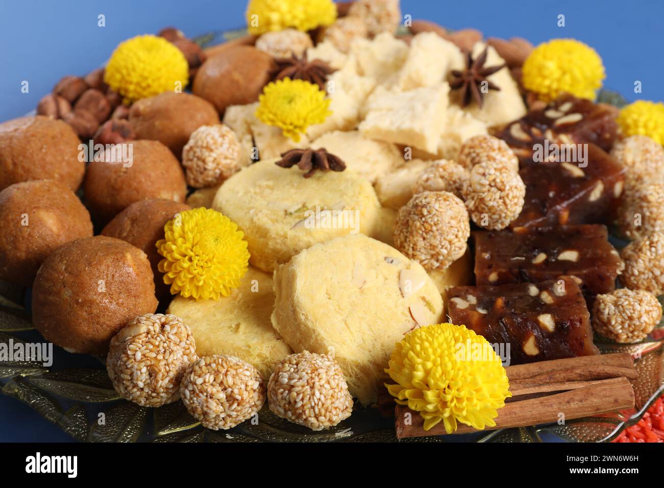 Diwali celebration. Tasty Indian sweets, spices and nuts on table ...